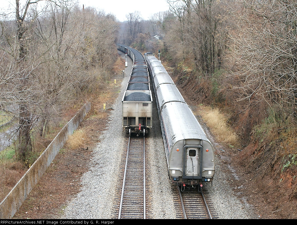 AMTK 176 (called "014" by the NS) passes a waiting "88M" at the Blackwater Creek signals
